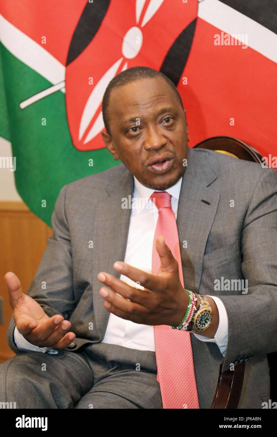 Kenyan President Uhuru Kenyatta speaks in an interview in Tokyo on ...