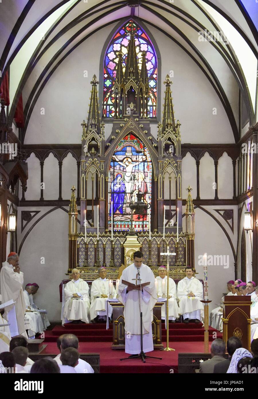 A message from Pope Francis is read aloud during a mass at Oura ...