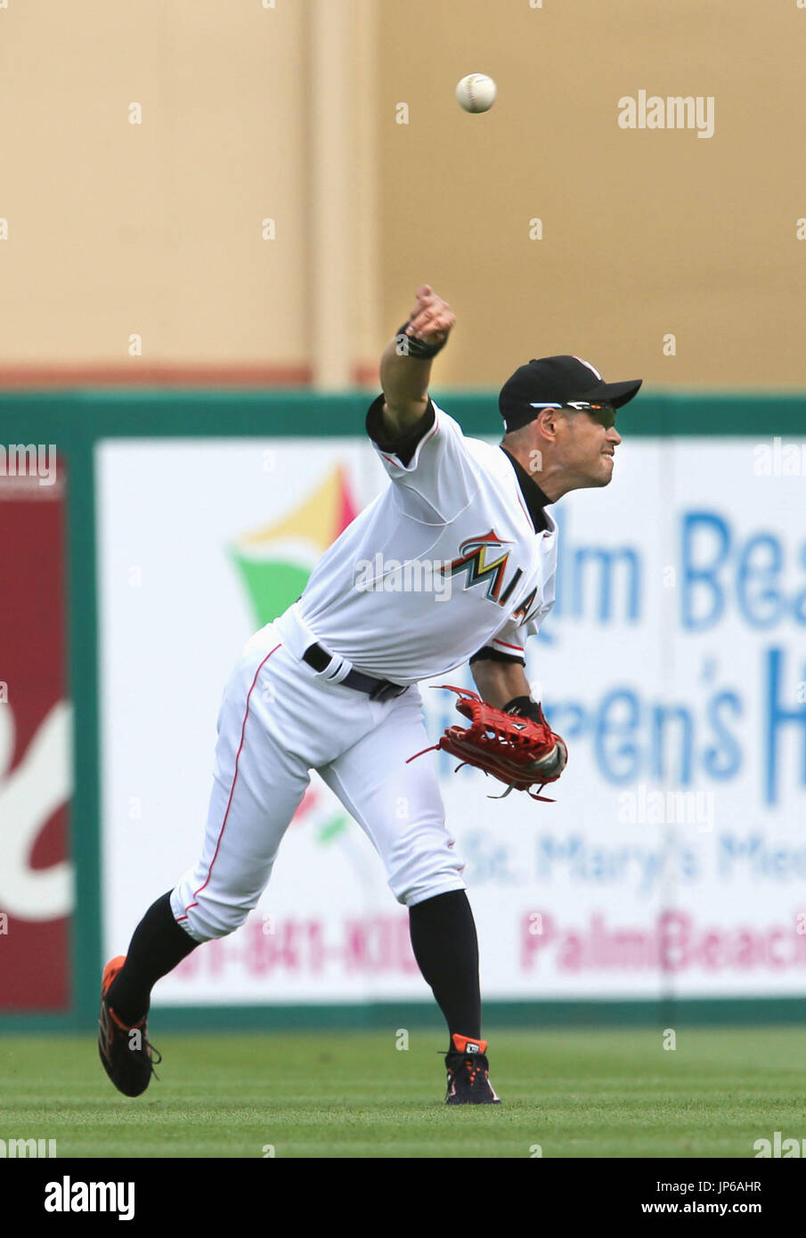 Japanese leftfielder Ichiro Suzuki of the Miami Marlins guns down a ...