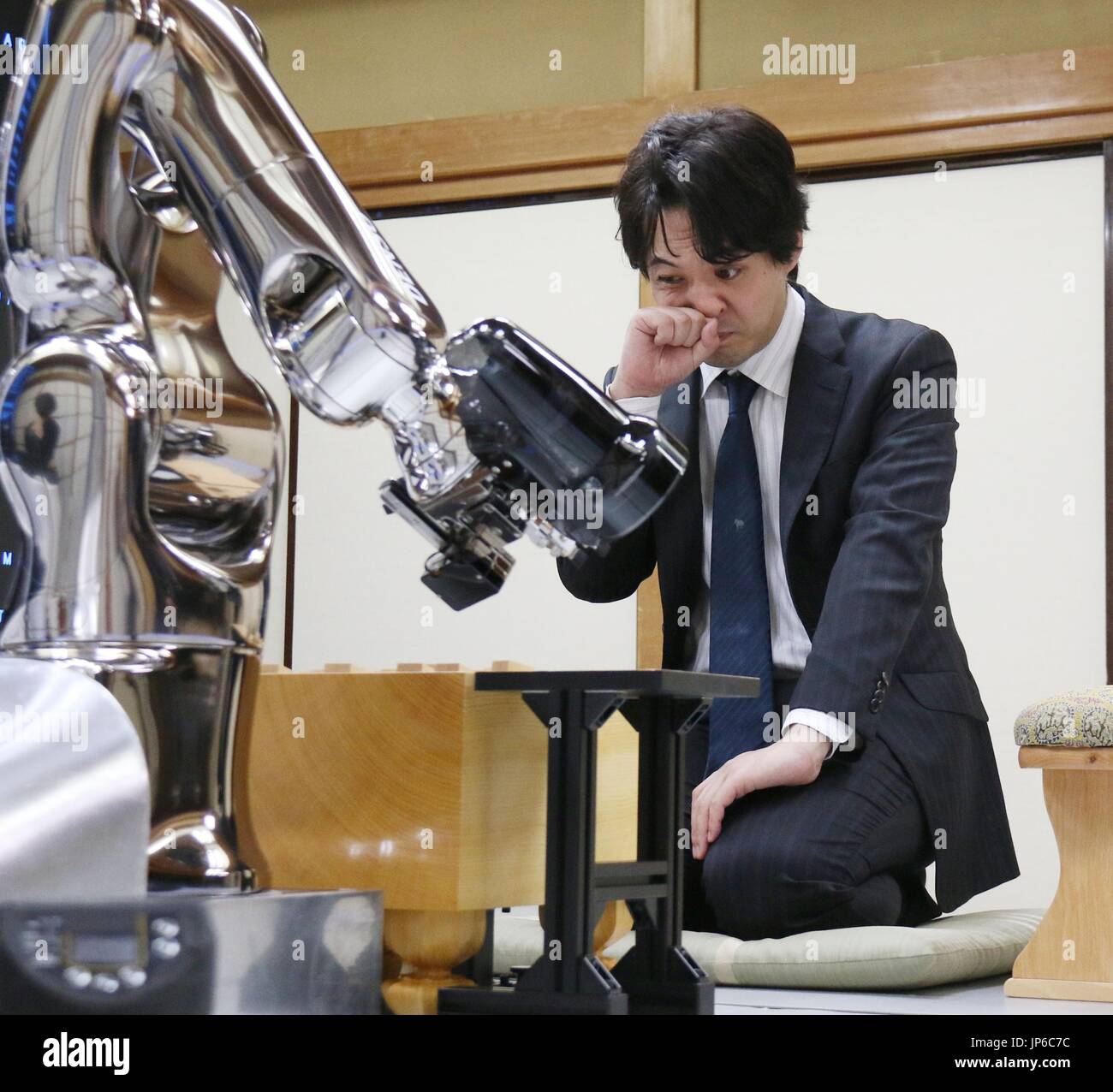 Professional shogi (Japanese chess) player Chikara Akutsu beats shogi ...