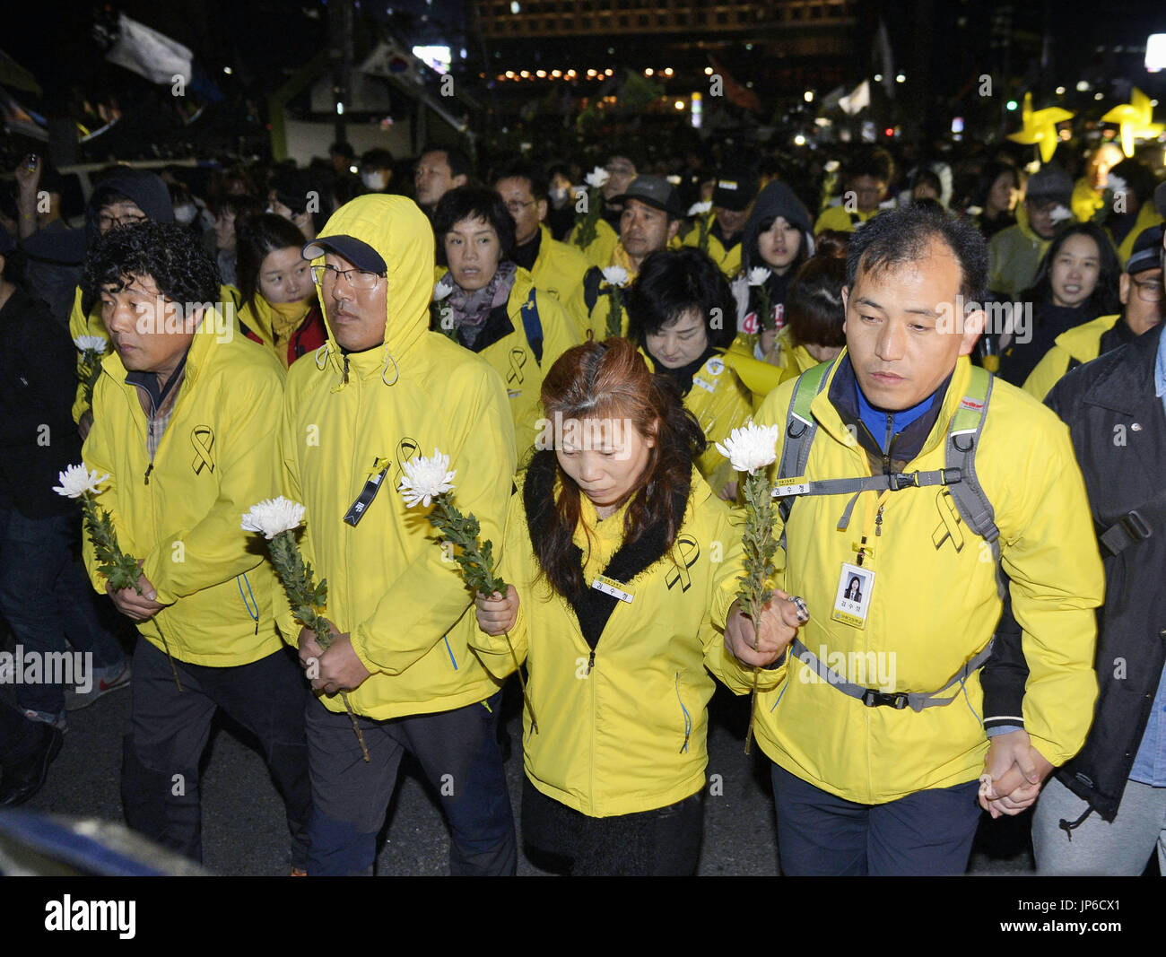 Relatives of the victims of the Sewol ferry disaster march in downtown ...