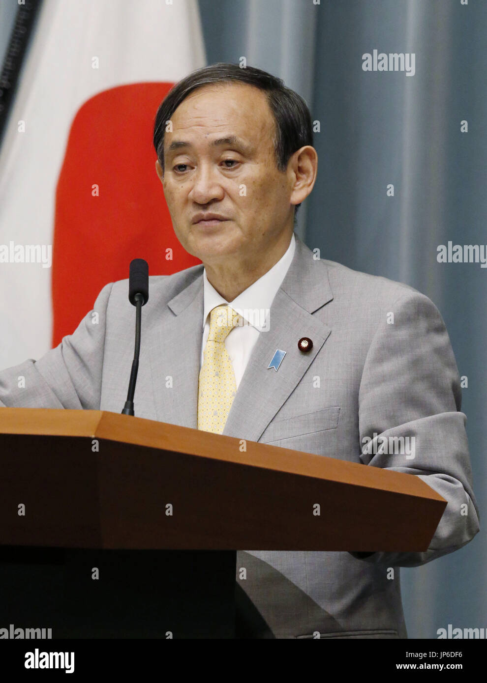Japanese Chief Cabinet Secretary Yoshihide Suga attends a press ...