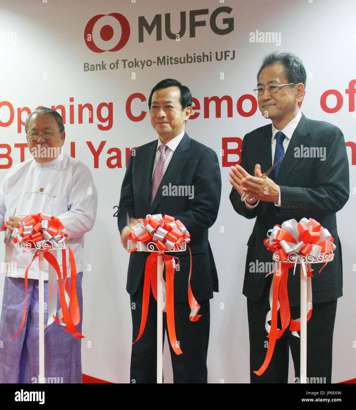Tateshi Higuchi (R), Japanese ambassador to Myanmar, applauds during ...