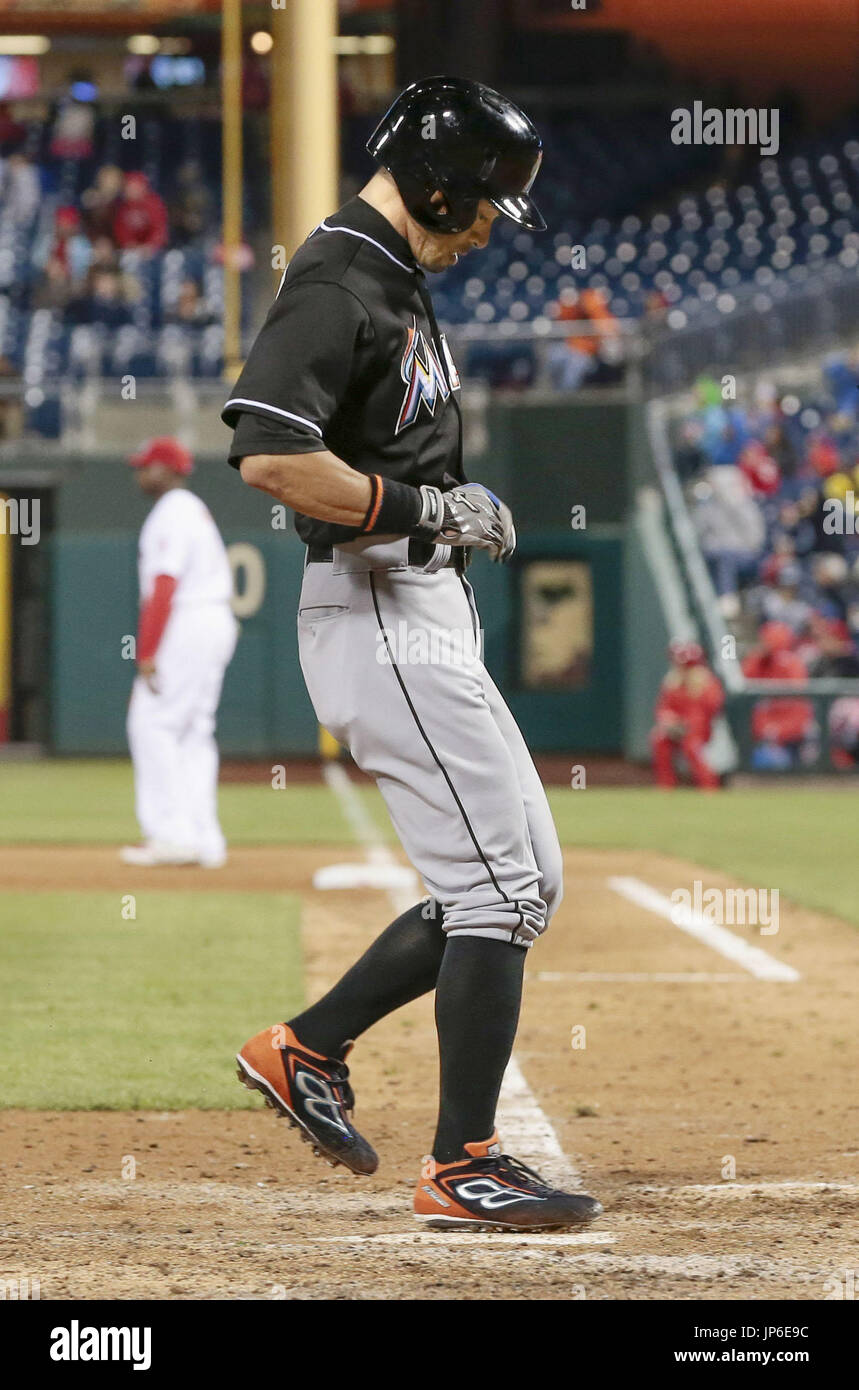 Miami Marlins outfielder Ichiro Suzuki scores in the eighth inning ...