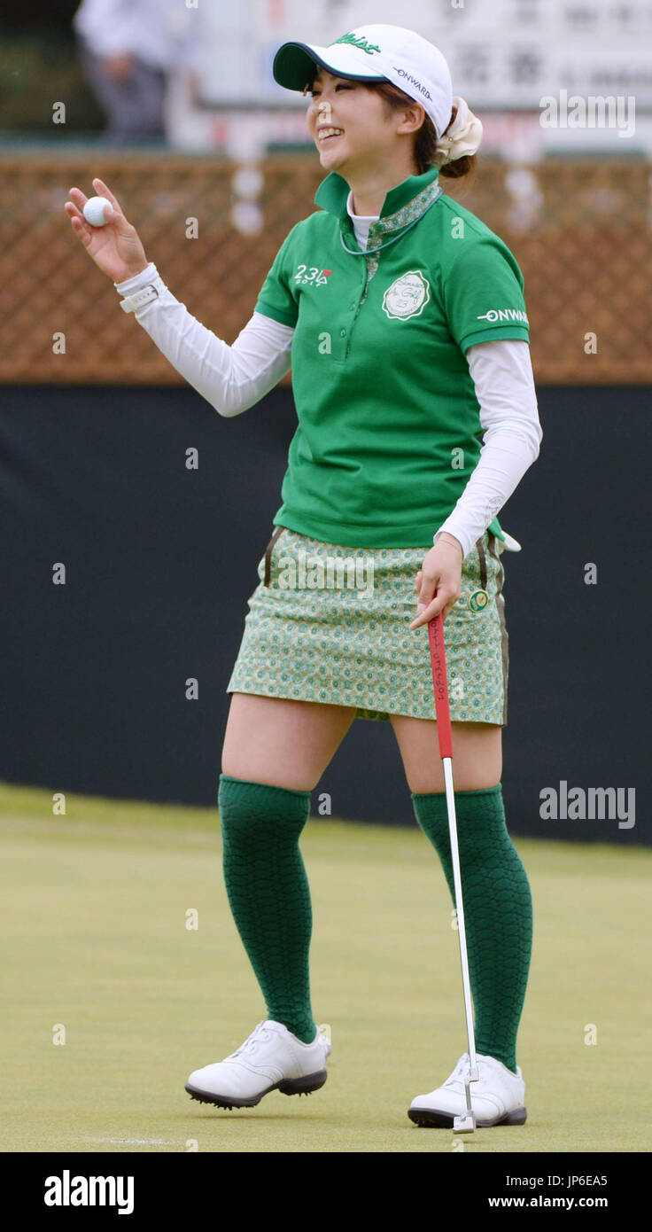 Erika Kikuchi of Japan responds to the gallery after sinking a birdie putt on the final hole to ...