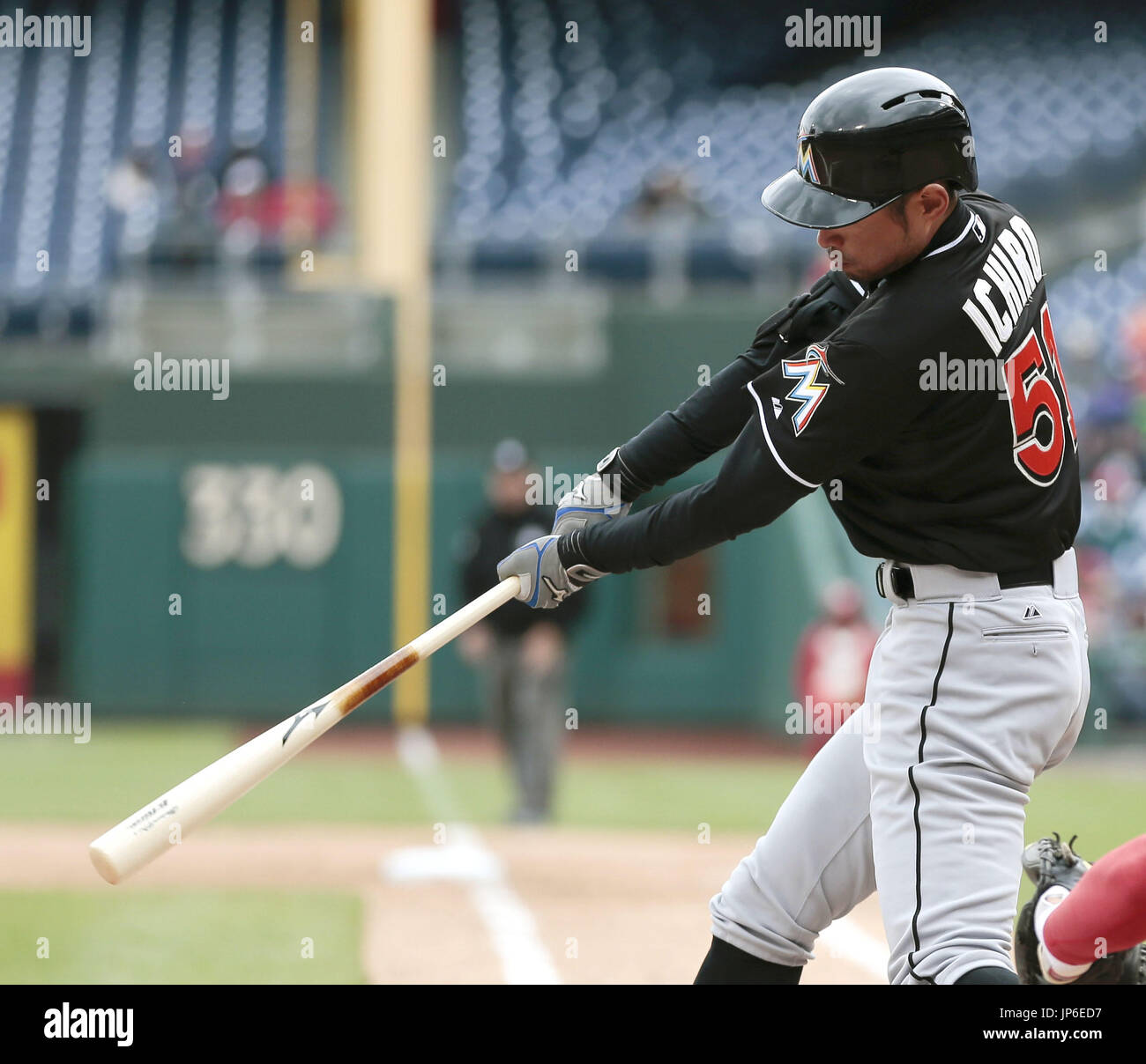 Ichiro Suzuki singles to left field in the seventh inning of the Miami ...