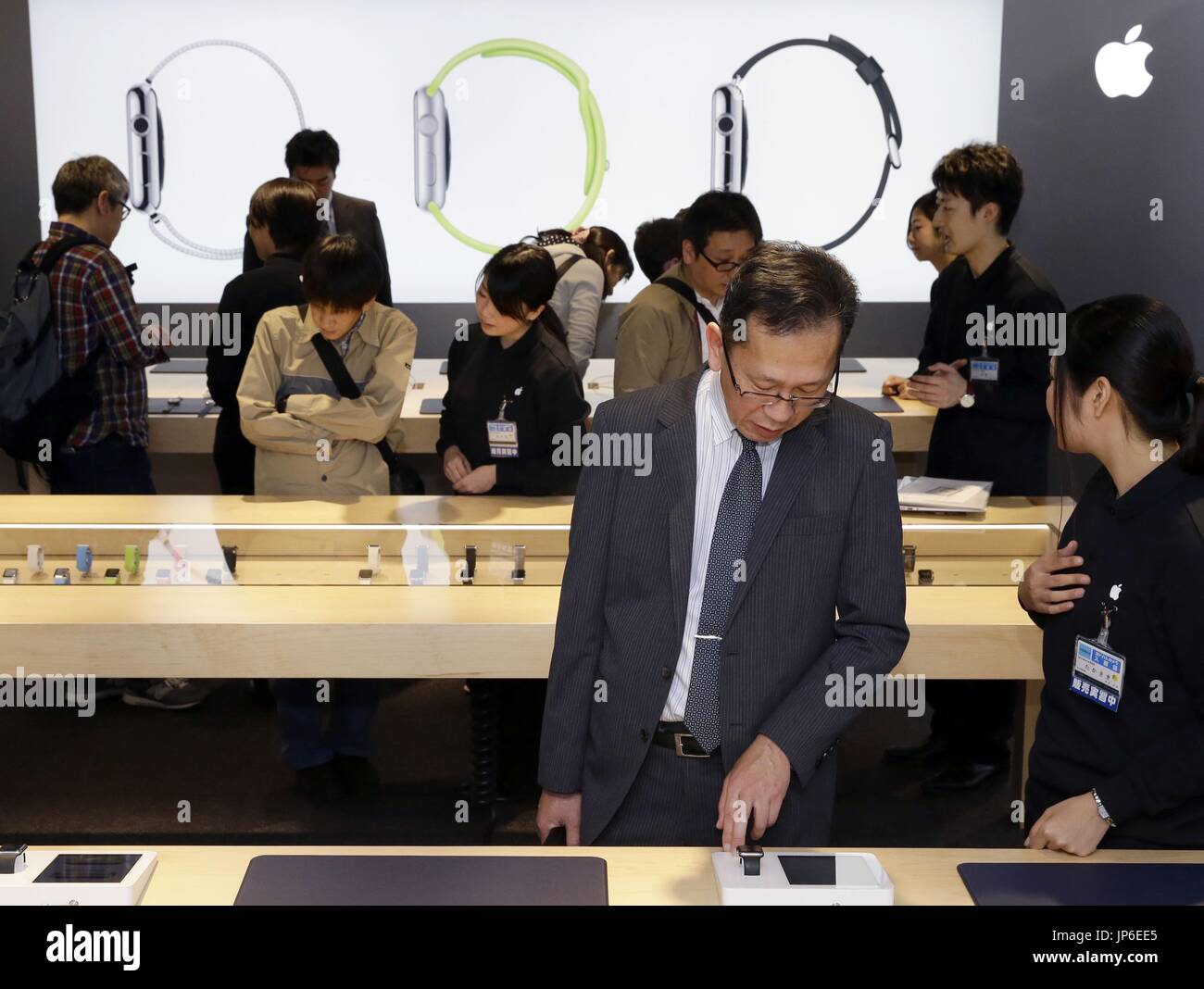 People view newly-launched Apple Watches created by Apple Inc. at a ...