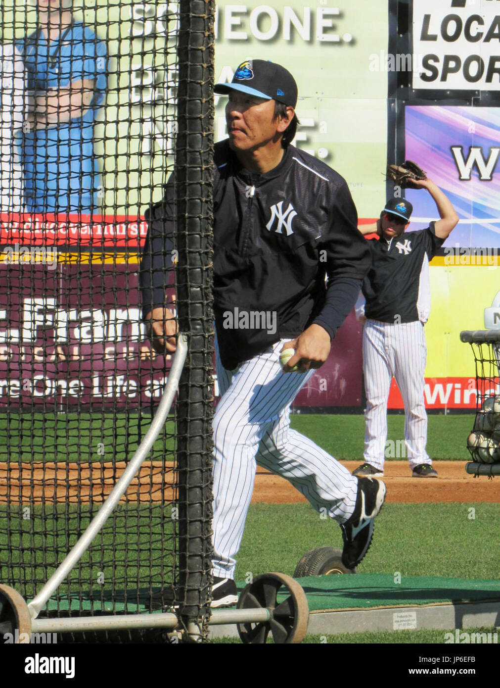 Former New York Yankees slugger Hideki Matsui of Japan throws a pitch ...