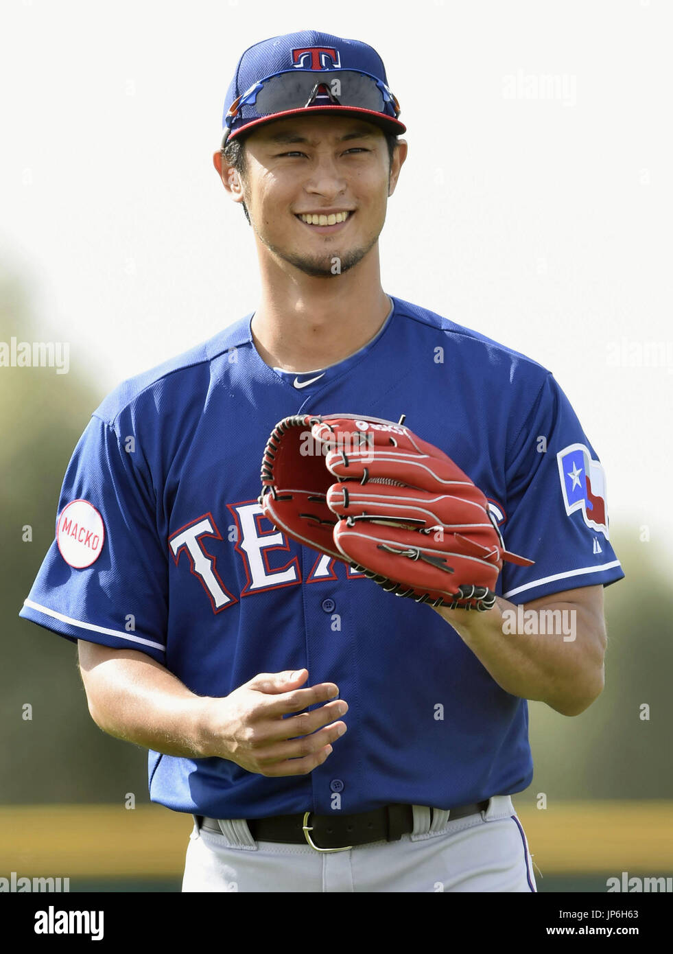 Texas Rangers pitcher Yu Darvish of Japan smiles during the first day ...