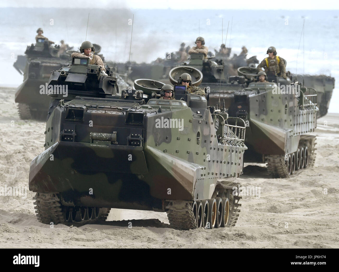 U.S. Marine Corps AAV7 Armored Personnel Vehicles carrying Japanese ...