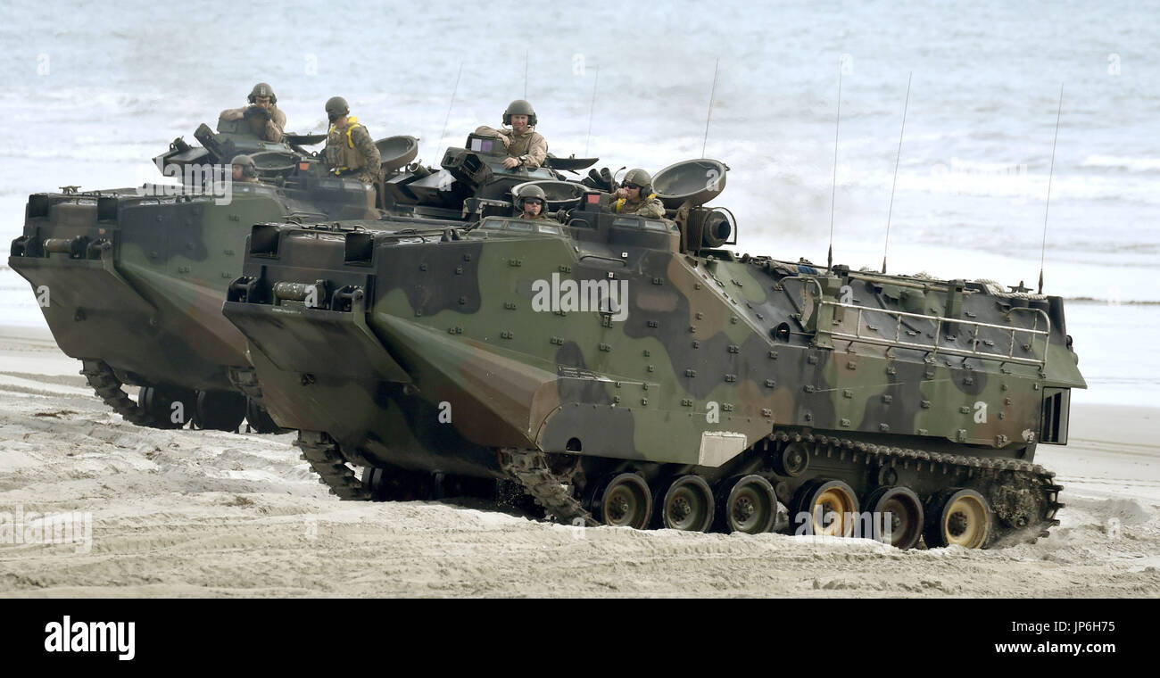 U.S. Marine Corps AAV7 Armored Personnel Vehicles carrying Japanese ...