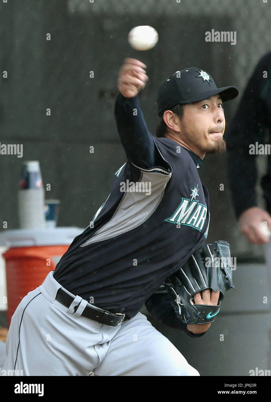 Seattle Mariners pitcher Hisashi Iwakuma throws in the bullpen at the ...