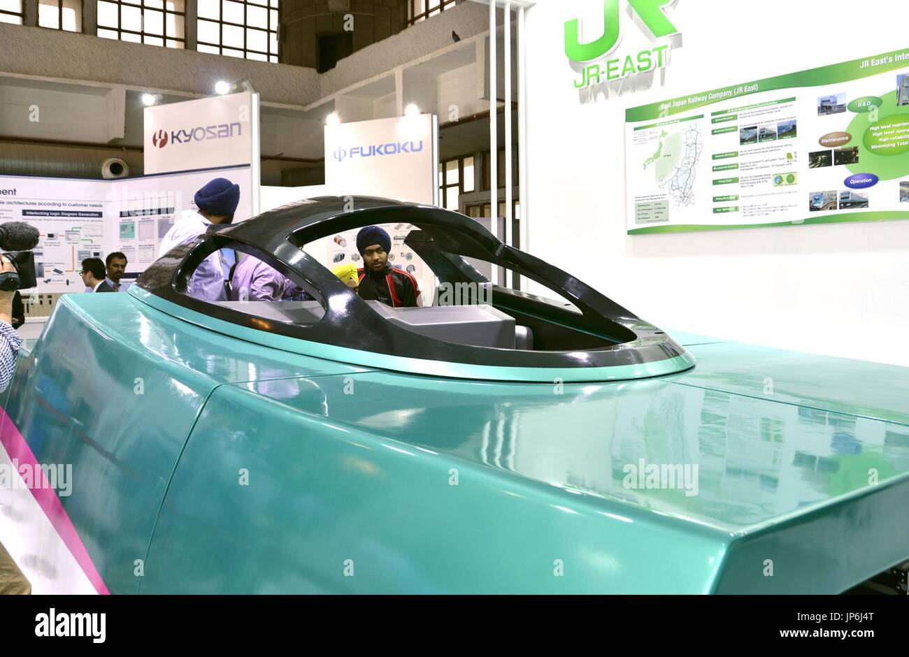 Indian visitors experience a Shinkansen bullet train system simulator ...