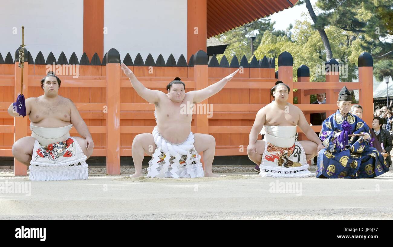 Professional sumo yokozuna (grand champion) Hakuho (C) conducts a ...
