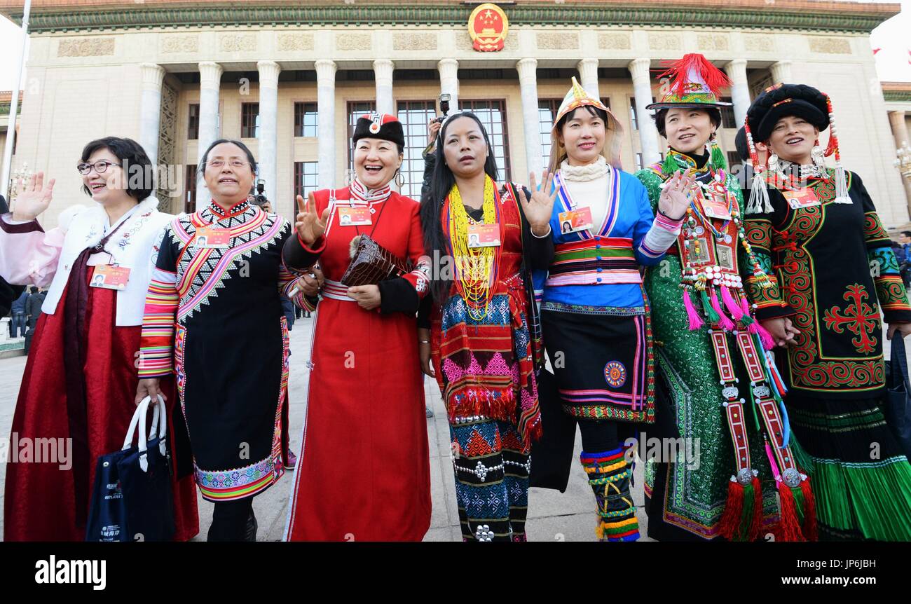 Ethnic minority representatives clad in colorful traditional clothes ...