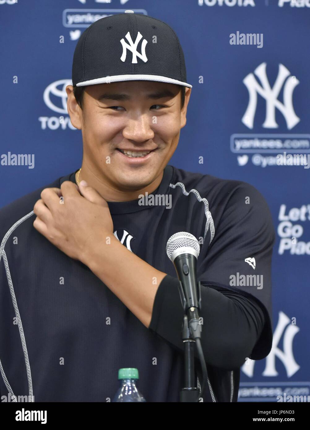 New York Yankees pitcher Masahiro Tanaka smiles as he speaks to the media in Washington on April ...
