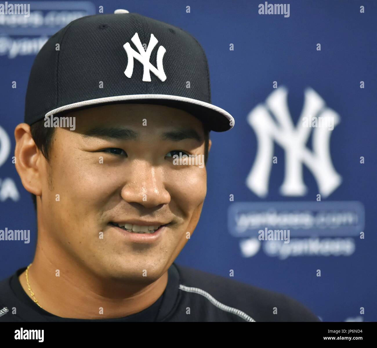 New York Yankees pitcher Masahiro Tanaka smiles as he speaks to the media in Washington on April ...