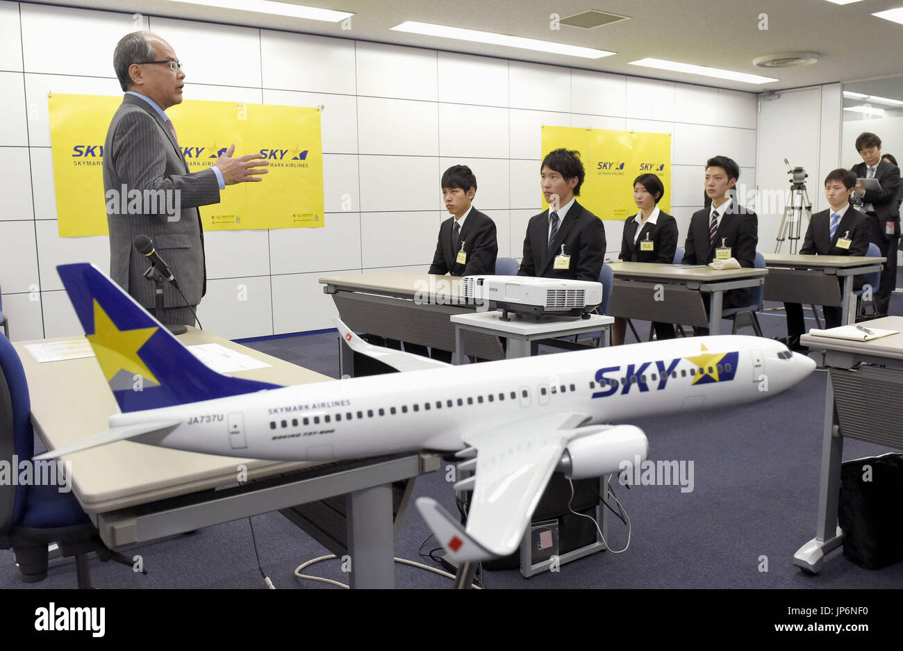 Takashi Ide, chairman of Skymark Airlines Inc., addresses a welcome ...