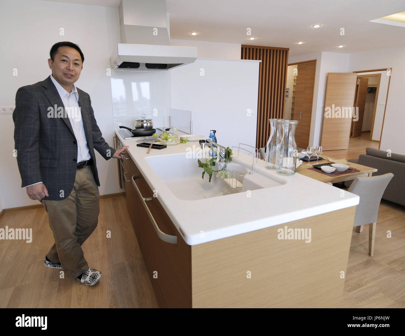 Hideki Ikeda, president of Home Tech Logos Rus in Russia's Vladivostok, explains the kitchen at ...