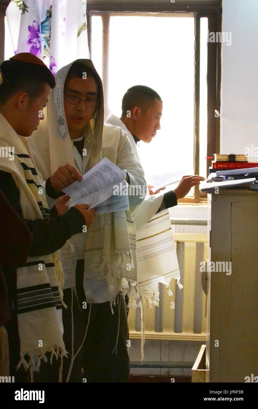 Barnaby Yeh of the U.S.-based Sino-Judaic Institute (C) leads a morning ...