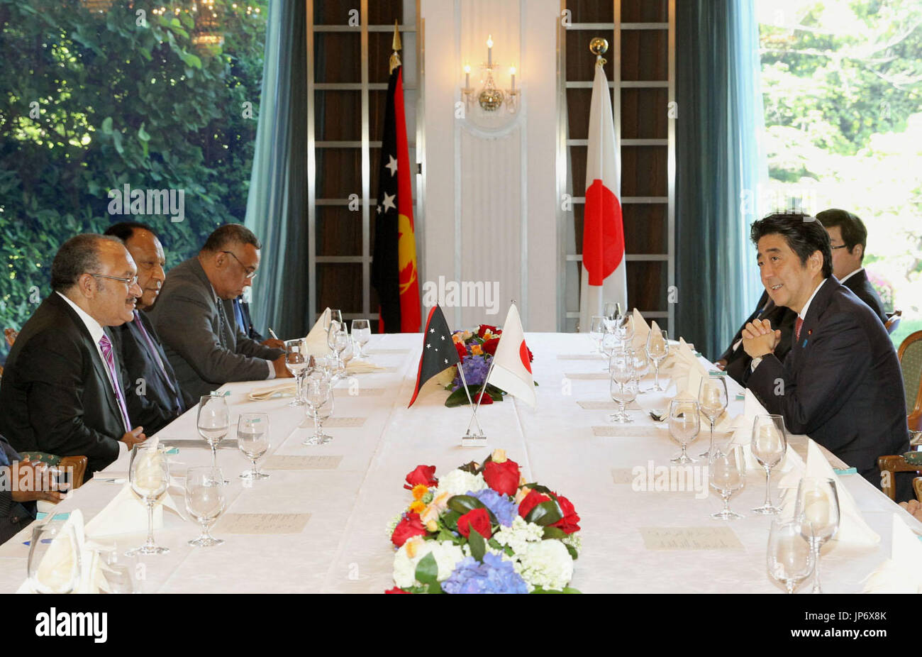 Japanese Prime Minister Shinzo Abe (far R) meets with Papua New Guinea ...