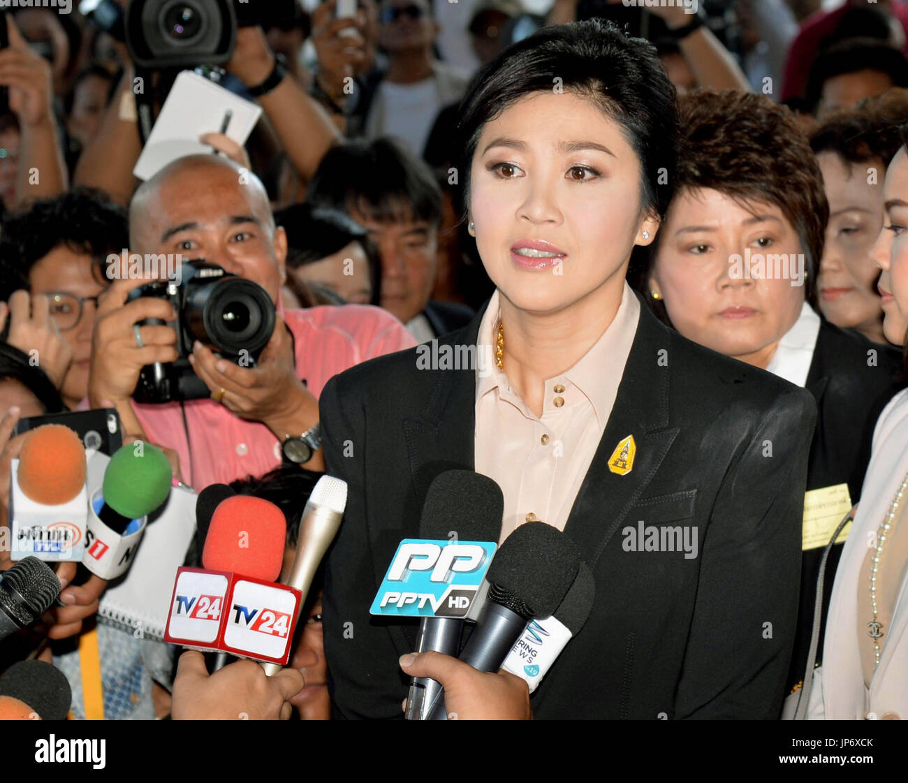 Former Thai Prime Minister Yingluck Shinawatra answers reporters ...