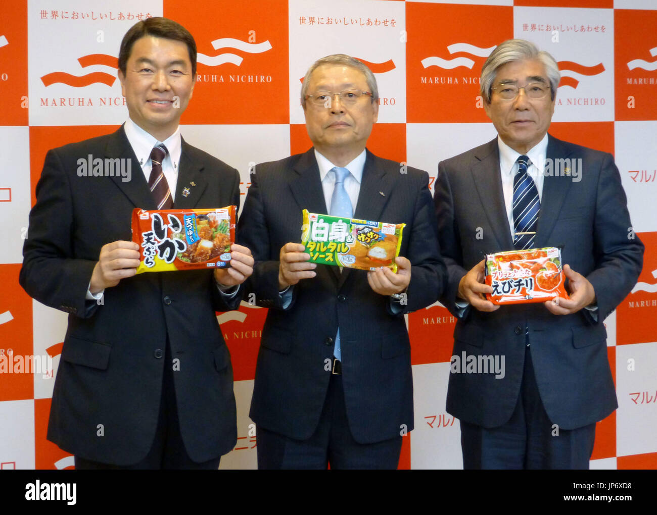 Maruha Nichiro Corp. President Shigeru Ito (C) poses for photos in ...