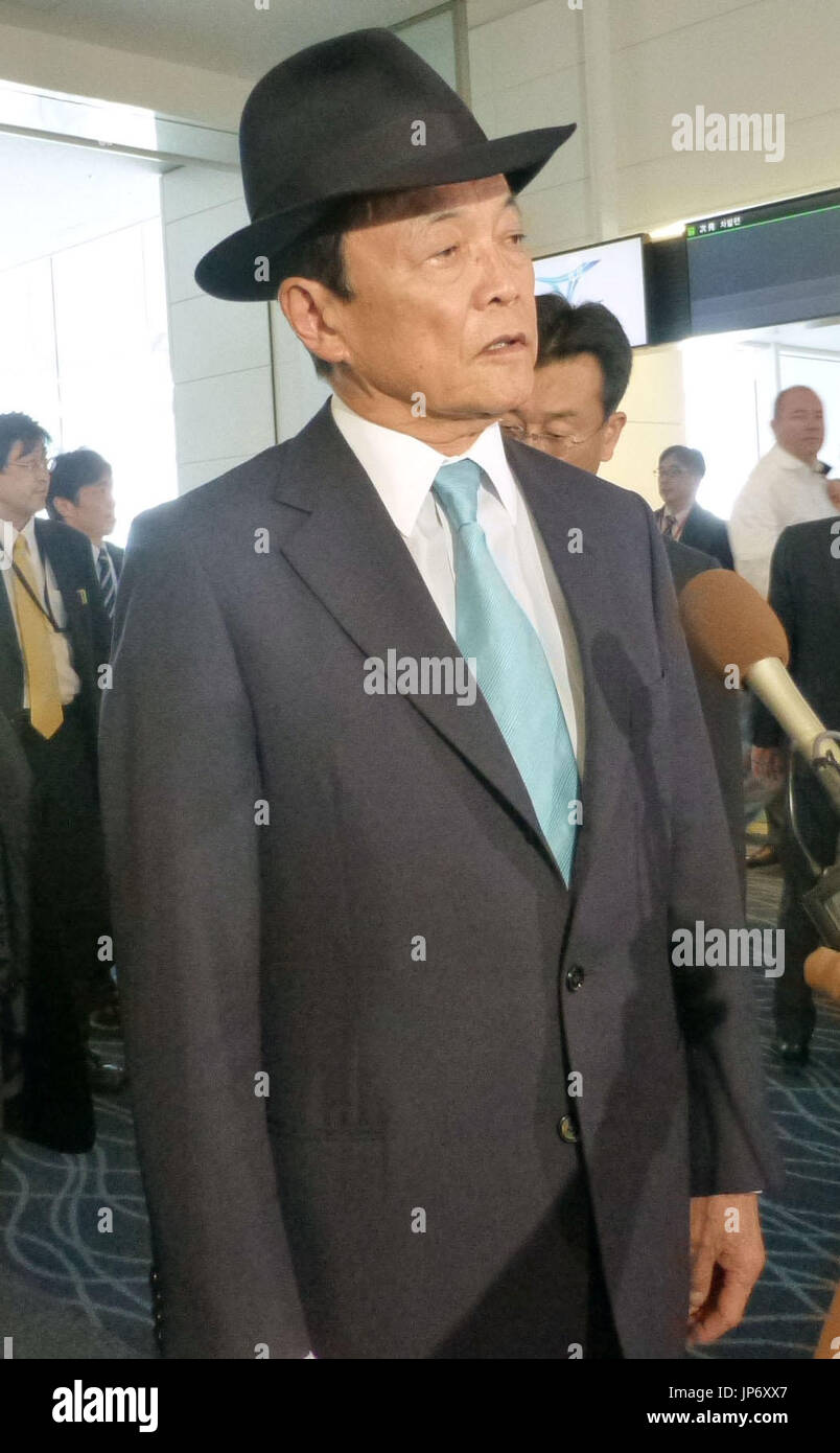 Japanese Finance Minister Taro Aso speaks to reporters at Tokyo's ...