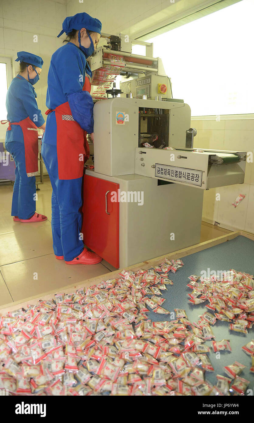 A machine churns out individually wrapped, nutrient-fortified rice ...