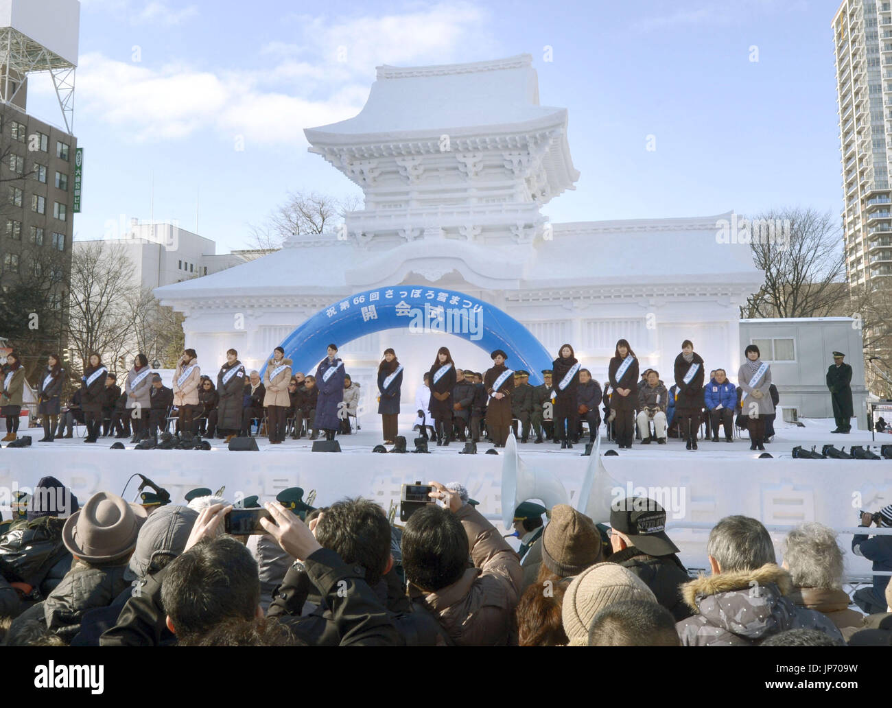 Crowds of visitors take pictures during the opening ceremony for the ...