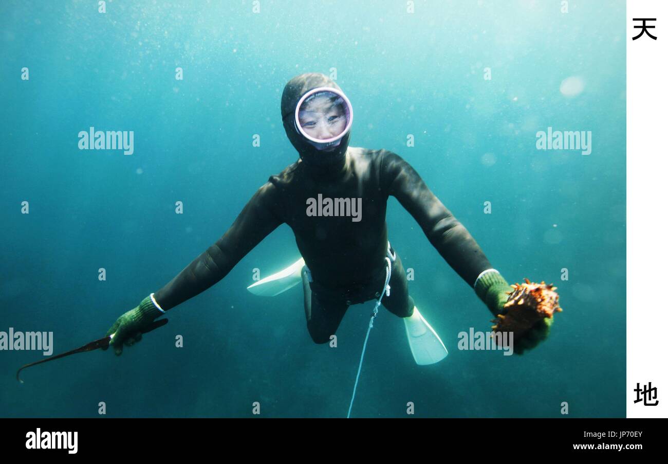 South Korean female diver Kim Mi Jin, trained in Japan, holds a sea ...