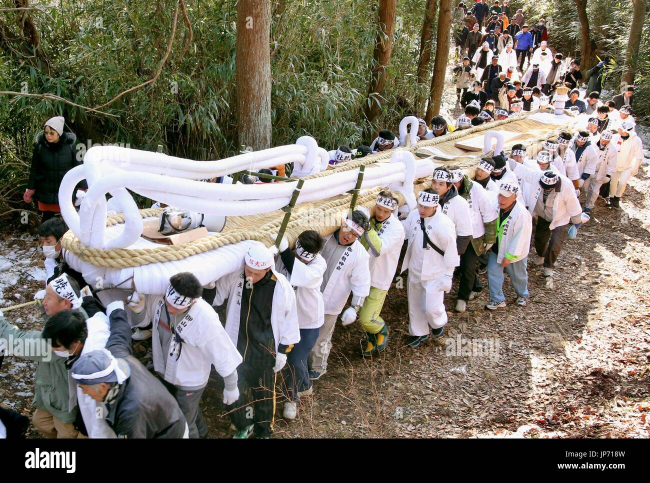 People carry a giant "waraji" straw sandal to a mountain shrine in ...