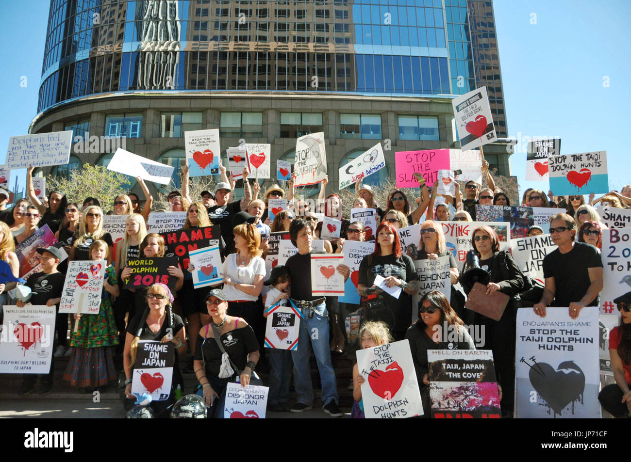 People demonstrate outside the building housing the Japanese Consulate ...