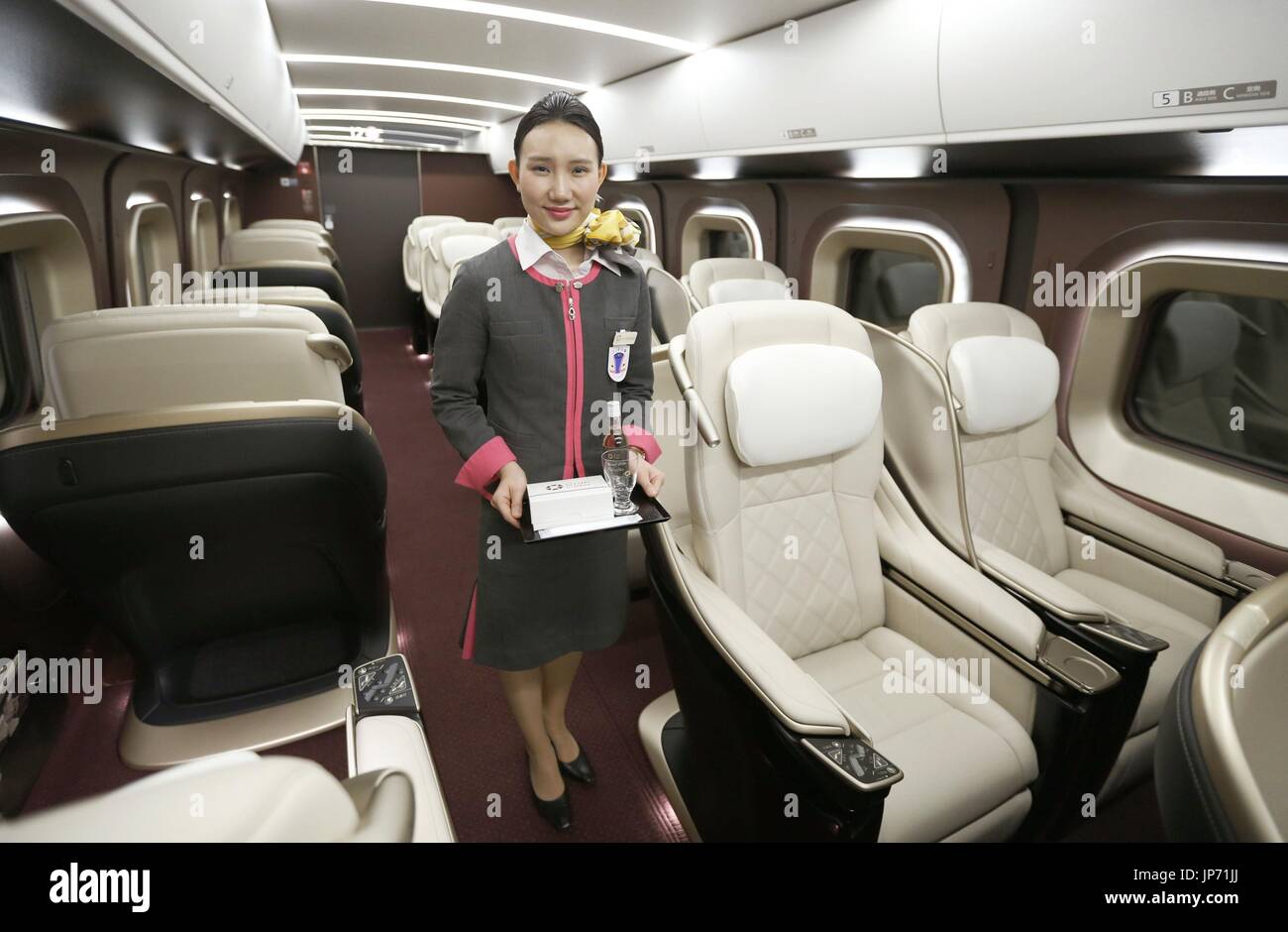This Feb. 5, 2015, photo shows an attendant in the "Gran Class" luxury ...