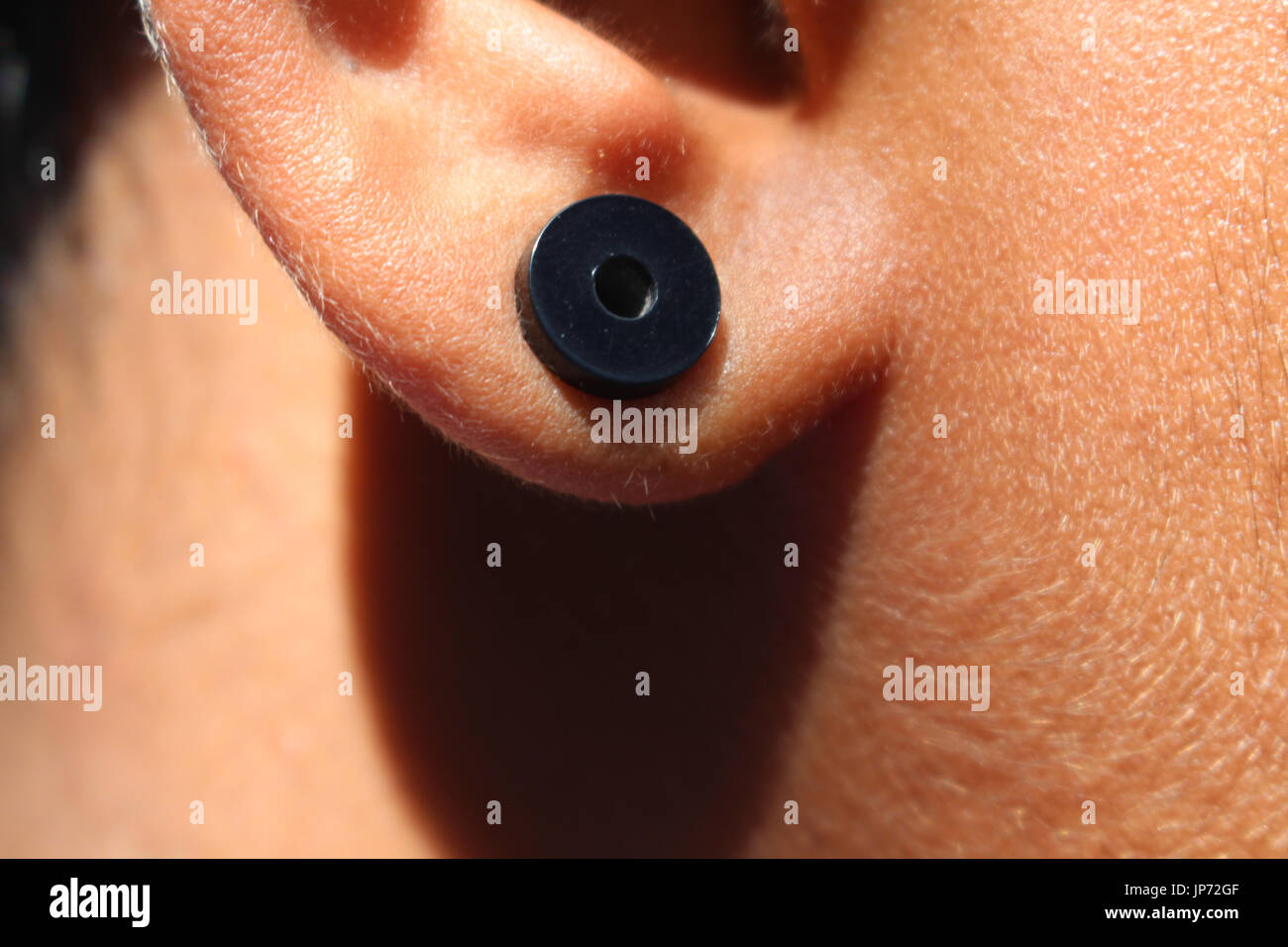 Pierced earlobes hi-res stock photography and images - Alamy