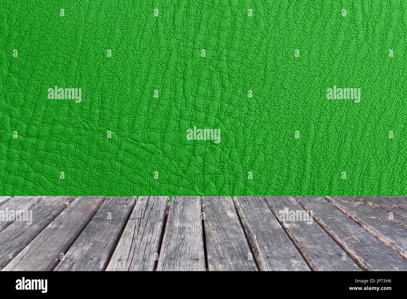 wood table on green leather texture Stock Photo - Alamy