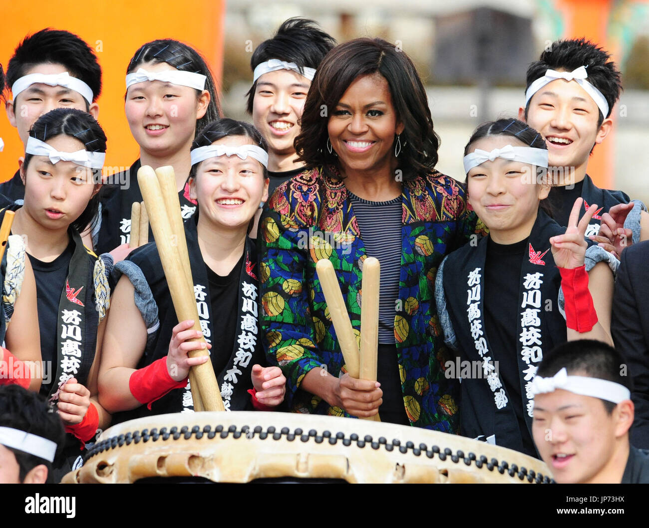 Michelle Obama (C) poses for a photo with high school students who gave ...