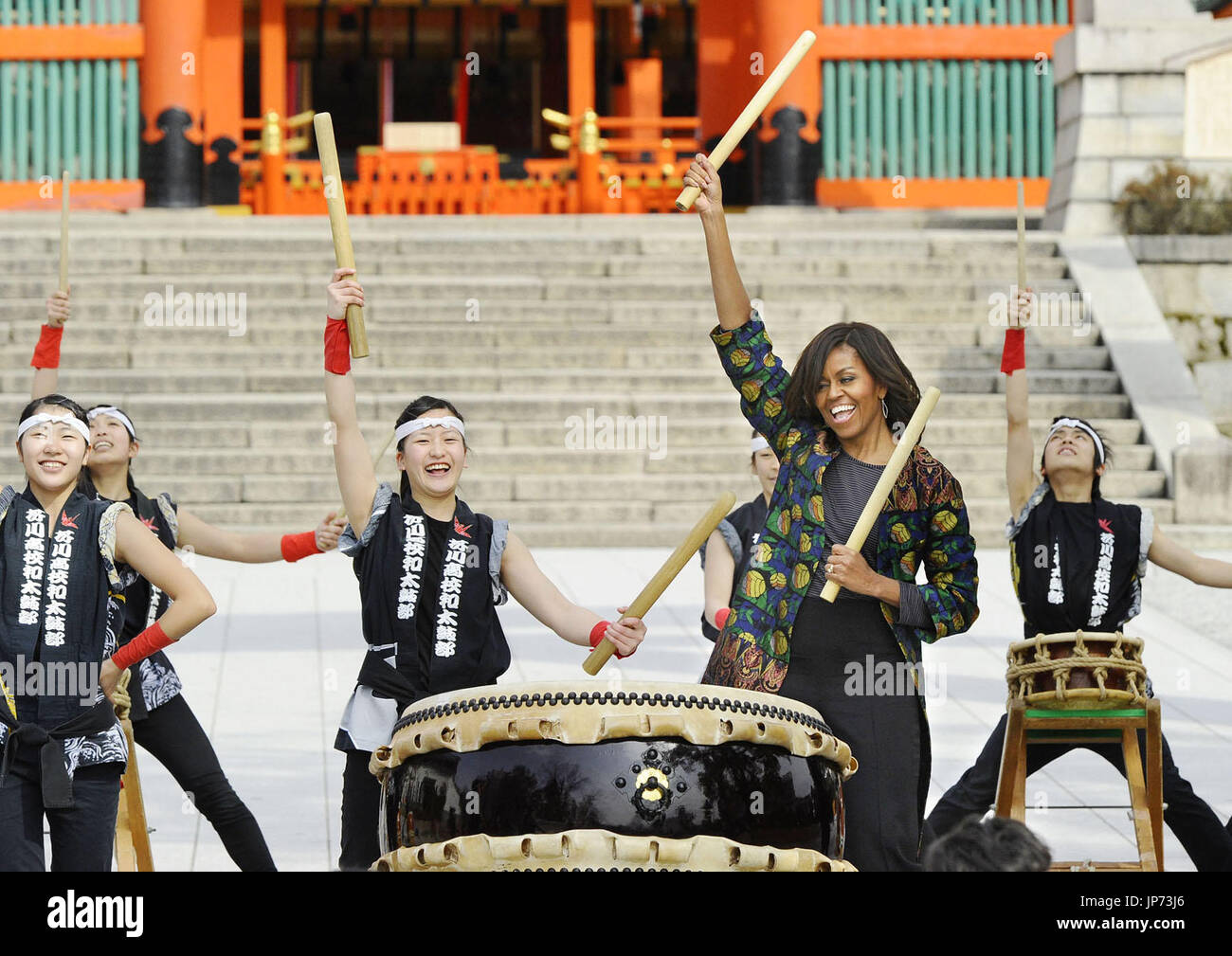 Michelle Obama (R in front row) plays the Japanese "wadaiko" drum at ...