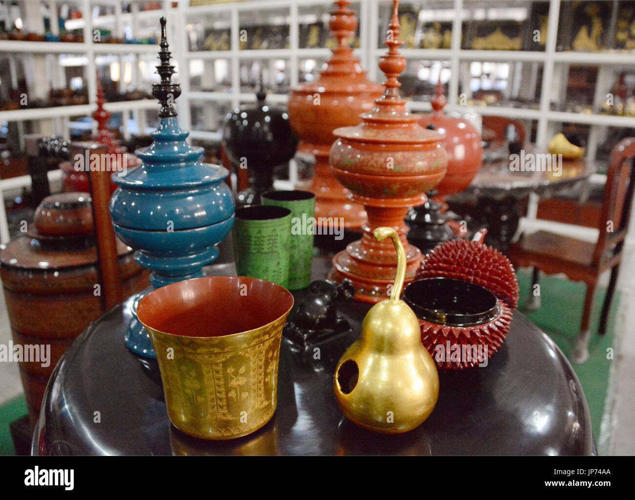 Colorful lacquerware products are displayed in various sizes and shapes ...