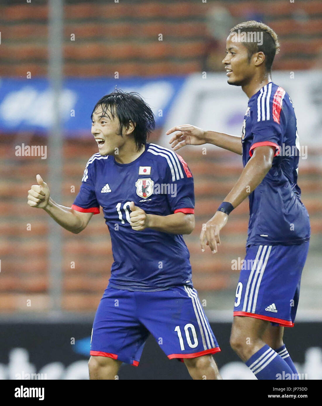 Shoya Nakajima (L) celebrates, alongside Musashi Suzuki, after scoring ...