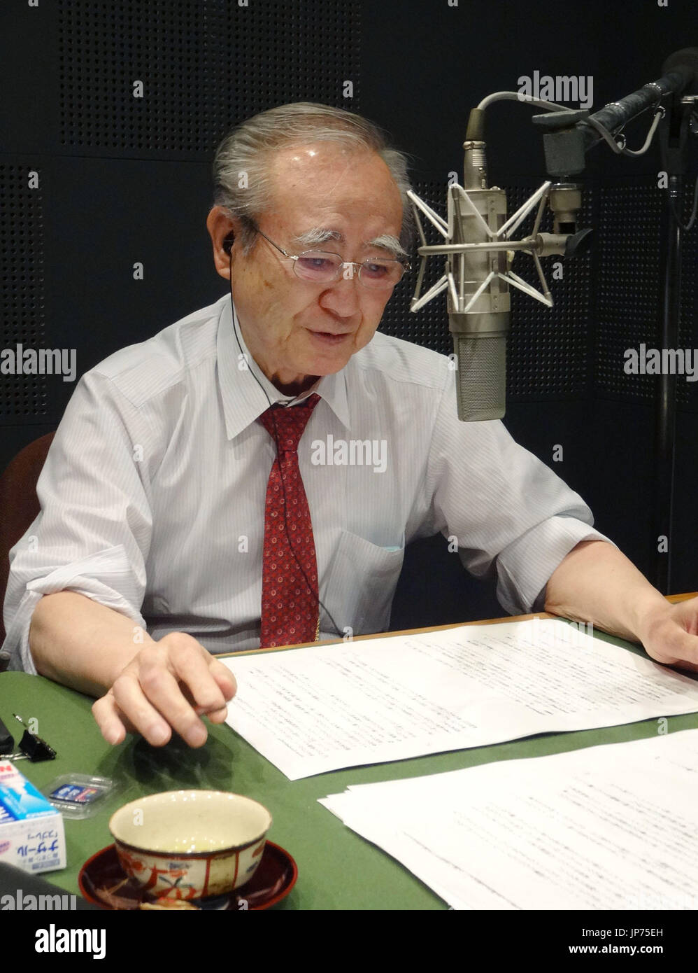 Veteran voice actor Genzo Wakayama records a spy novel on a compact ...