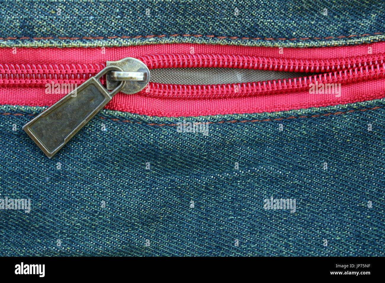 Zip of cloth background Stock Photo - Alamy