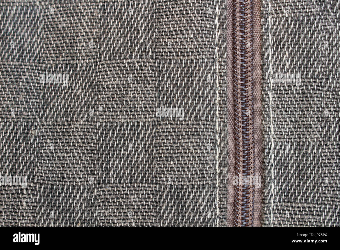 Zip of cloth background Stock Photo - Alamy