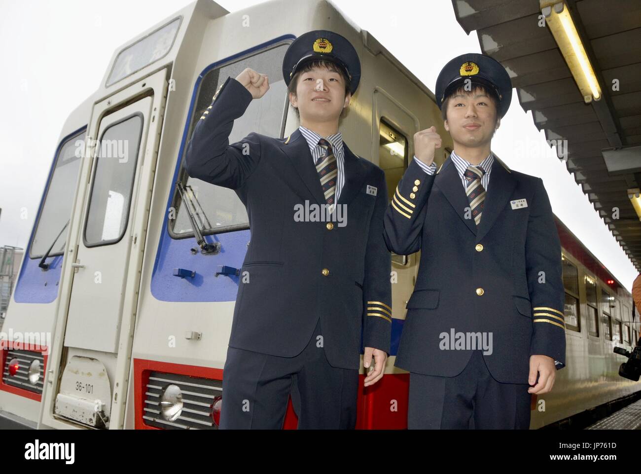 New employees of Sanriku Railway Co. pose for a photo in front of a ...