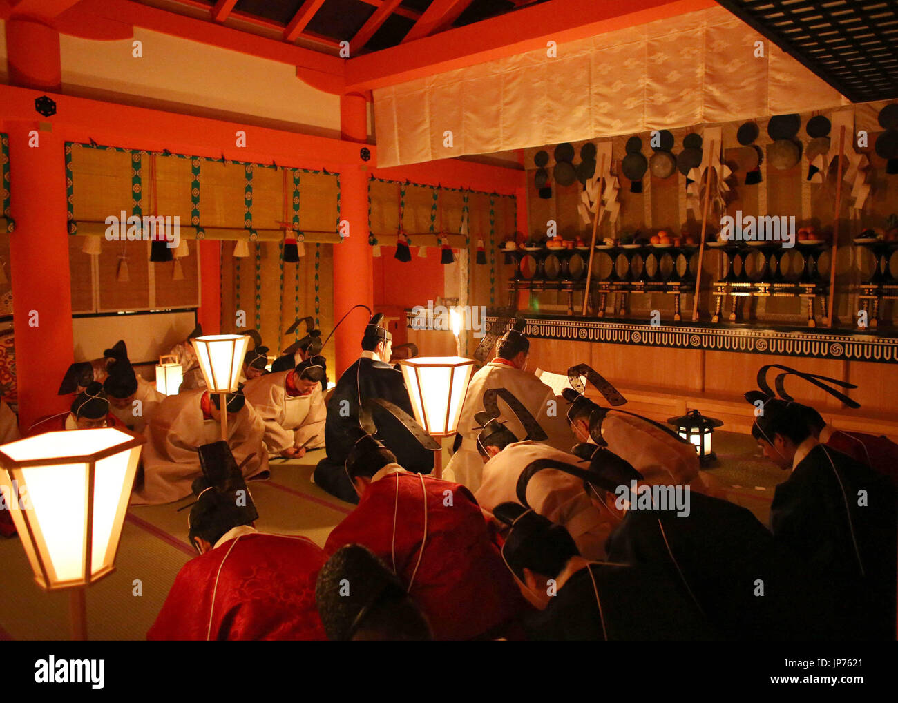 Shinto priests offer prayers in a temporary sanctuary after installing ...