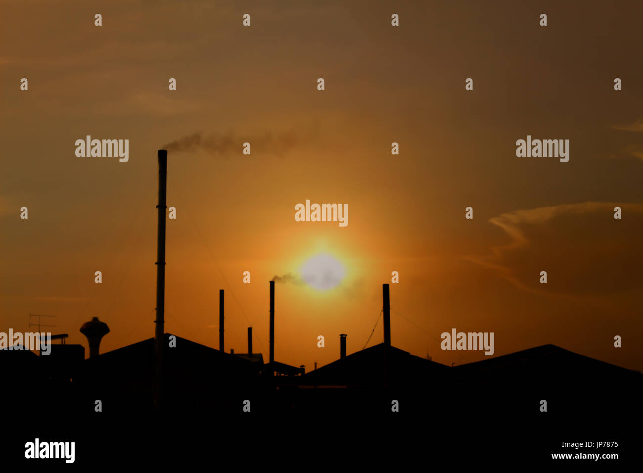 sunset on a factory roof Stock Photo - Alamy