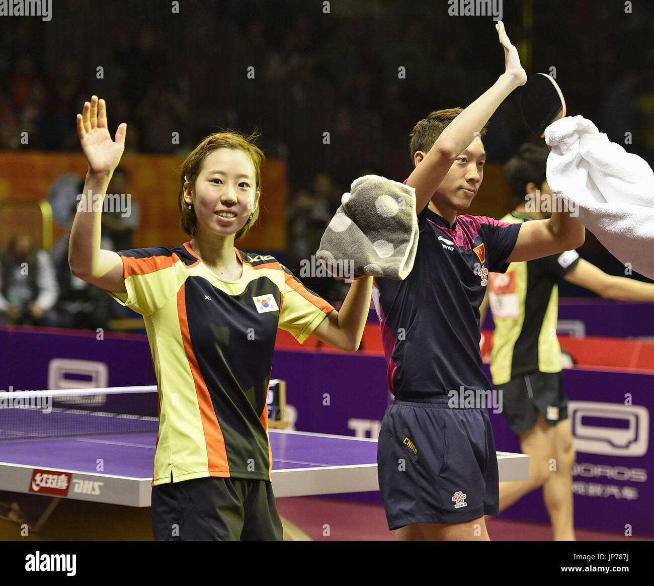China's Xu Xin (R) and Yang Hae Un of South Korea celebrate after ...