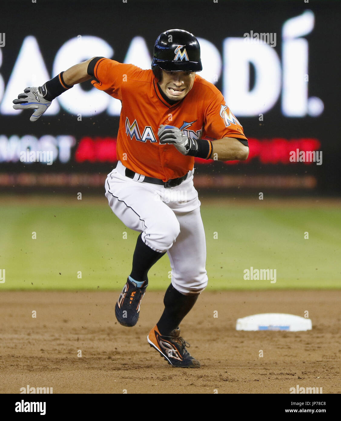 Miami Marlins' outfielder Ichiro Suzuki sprints to third base during ...