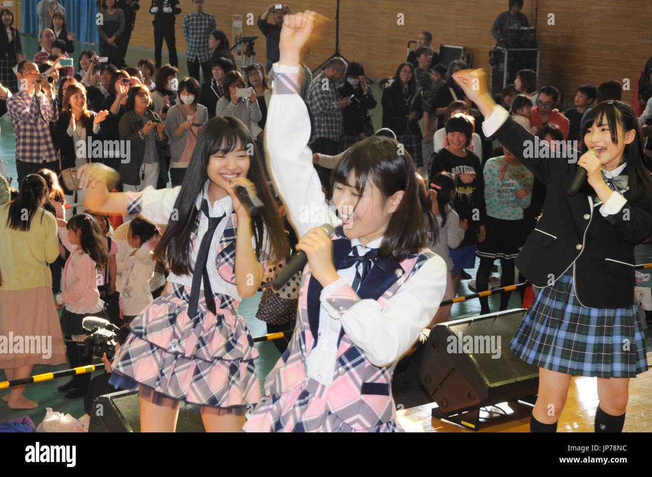 Members of the AKB48 Japanese all-girl pop group perform at the newly ...