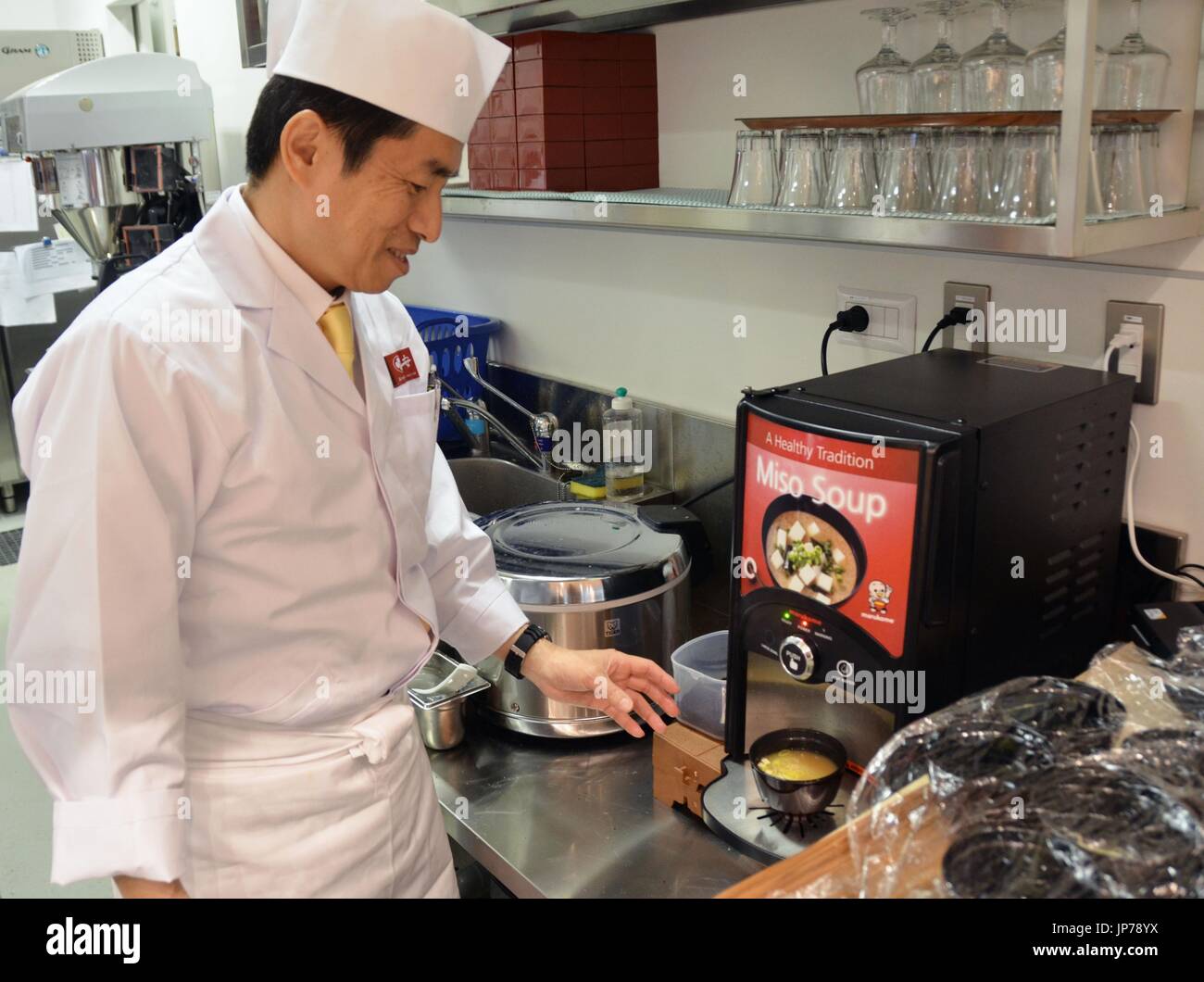 A Japanese cook uses a "miso" soybean paste soup server on May 1, 2015 ...